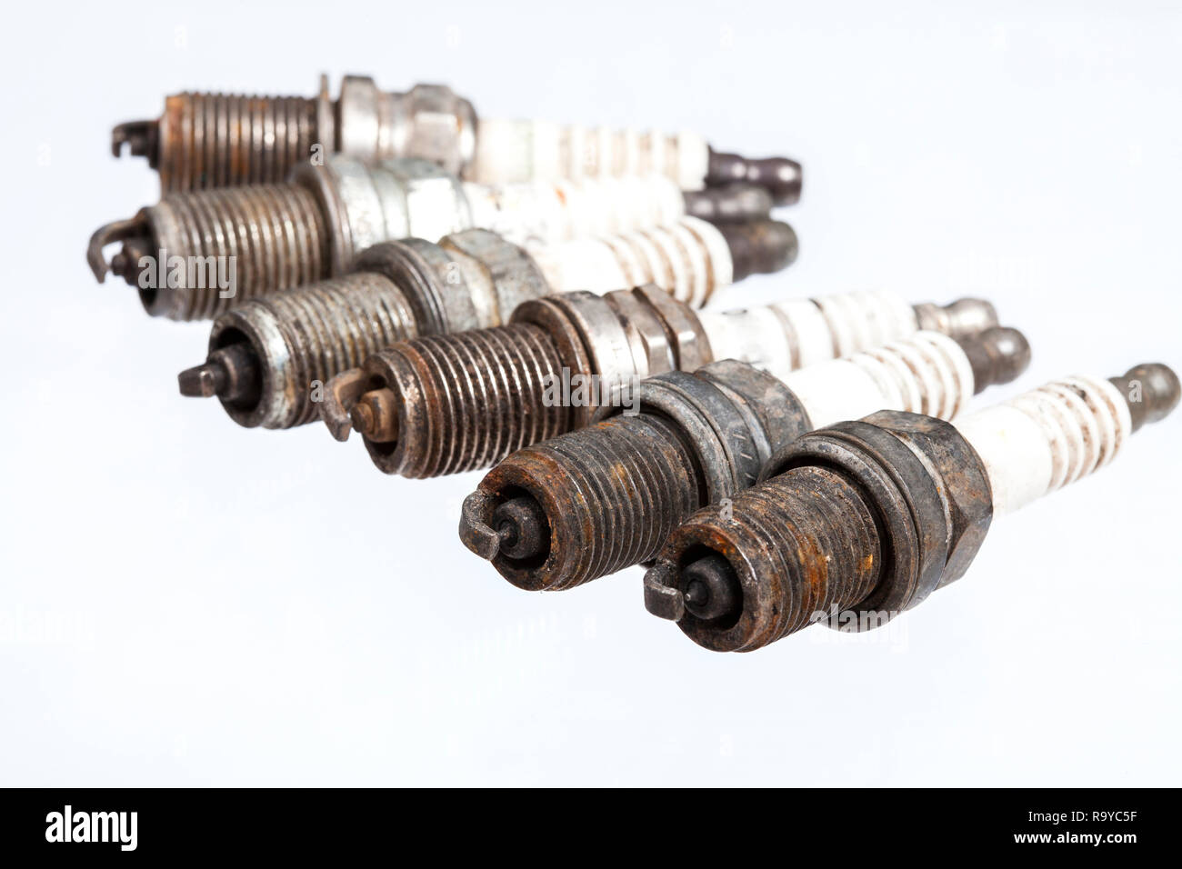 Heavily worn spark plugs isolated on white Stock Photo - Alamy