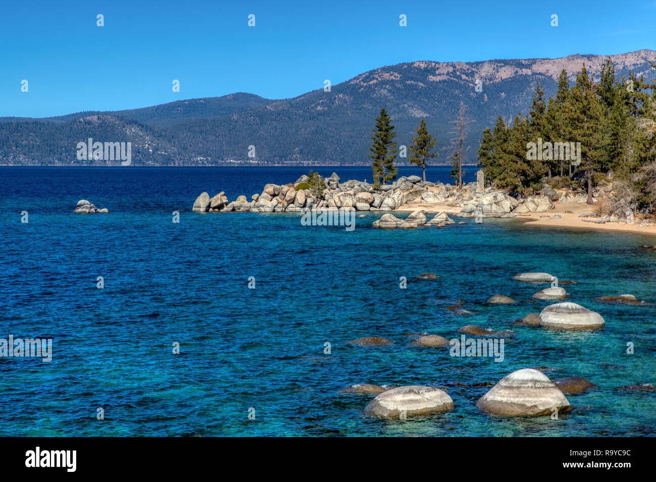 Unique boulders and colorful blue and turquoise water at Chimney Beach ...