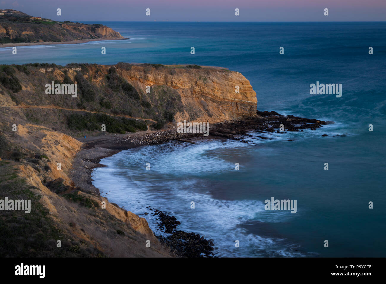 Long exposure photo of Inspiration Point cliff at sunset with waves ...