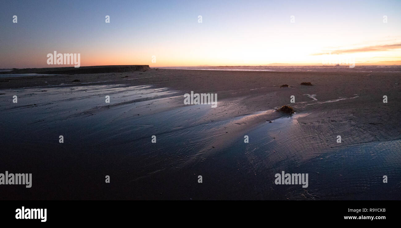 Sunset over Santa Clara River tidal outflow to Pacific Ocean at McGrath ...
