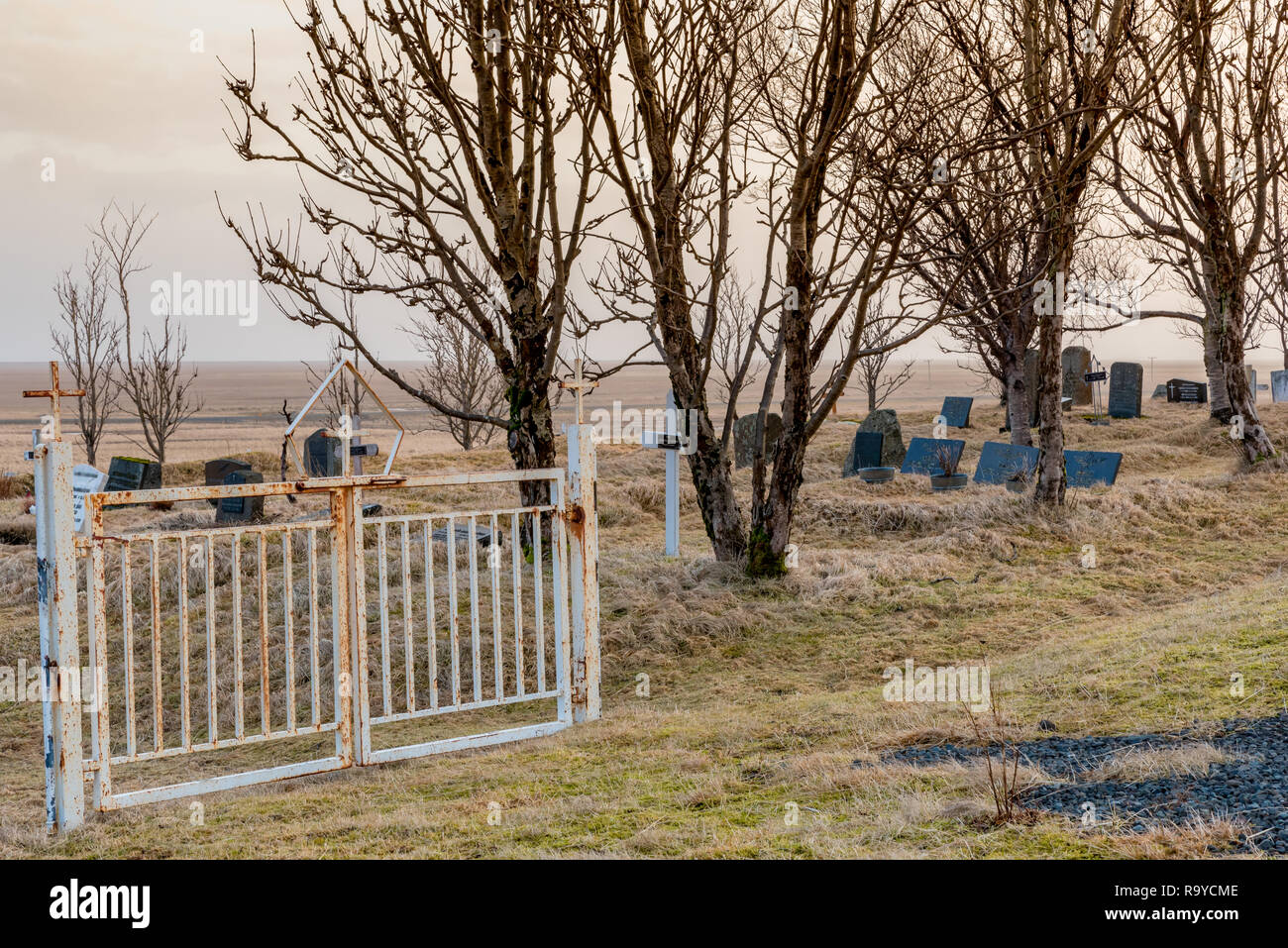 Gate into the Kalfafellsstadur Church graveyard in Iceland with crosses ...
