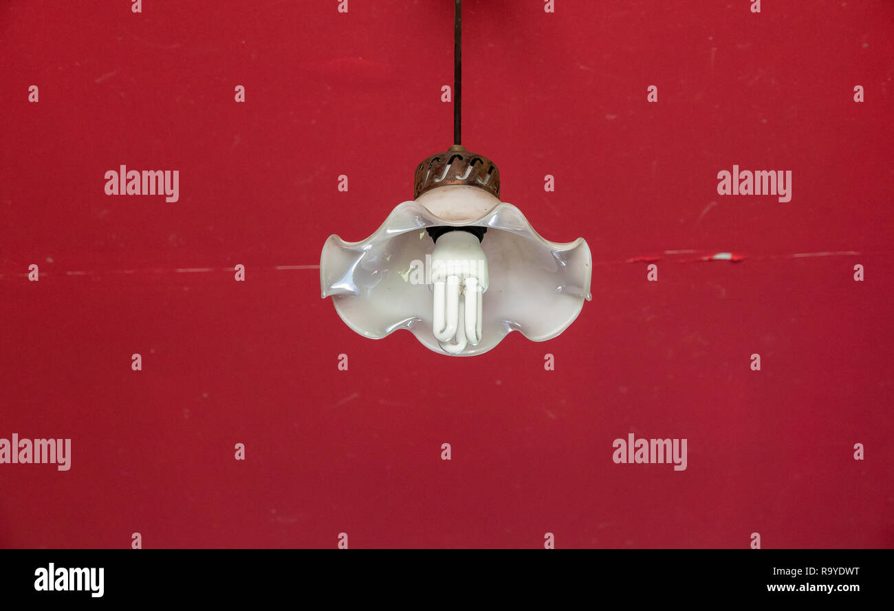 Ancient vintage lamp hanging from red ceiling background Stock Photo ...