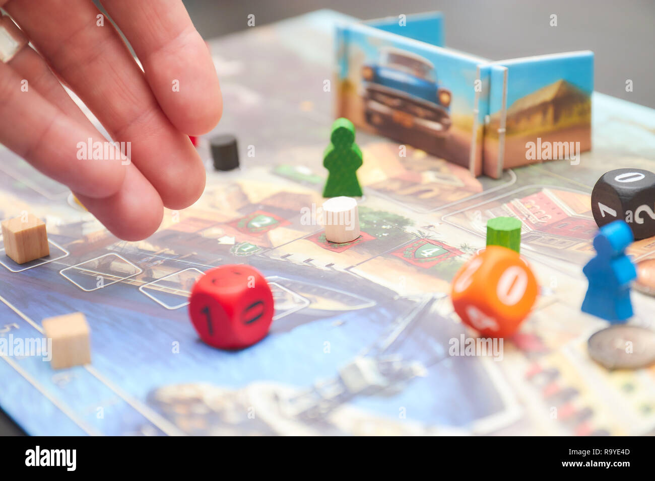Cubes with the game monopoly on the table Stock Photo - Alamy