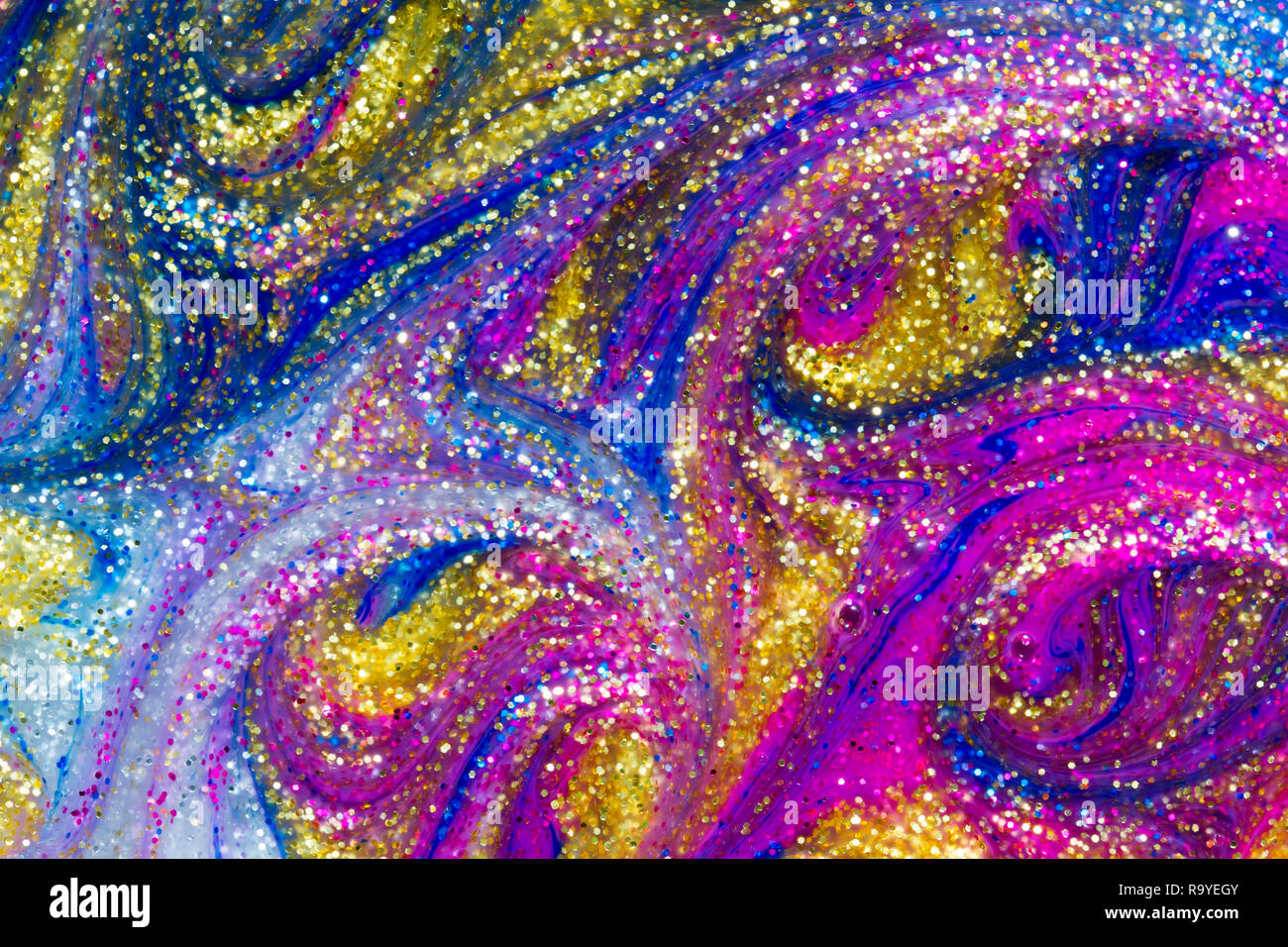 Abstract background of colorful metallic pink, blue, silver and gold ...