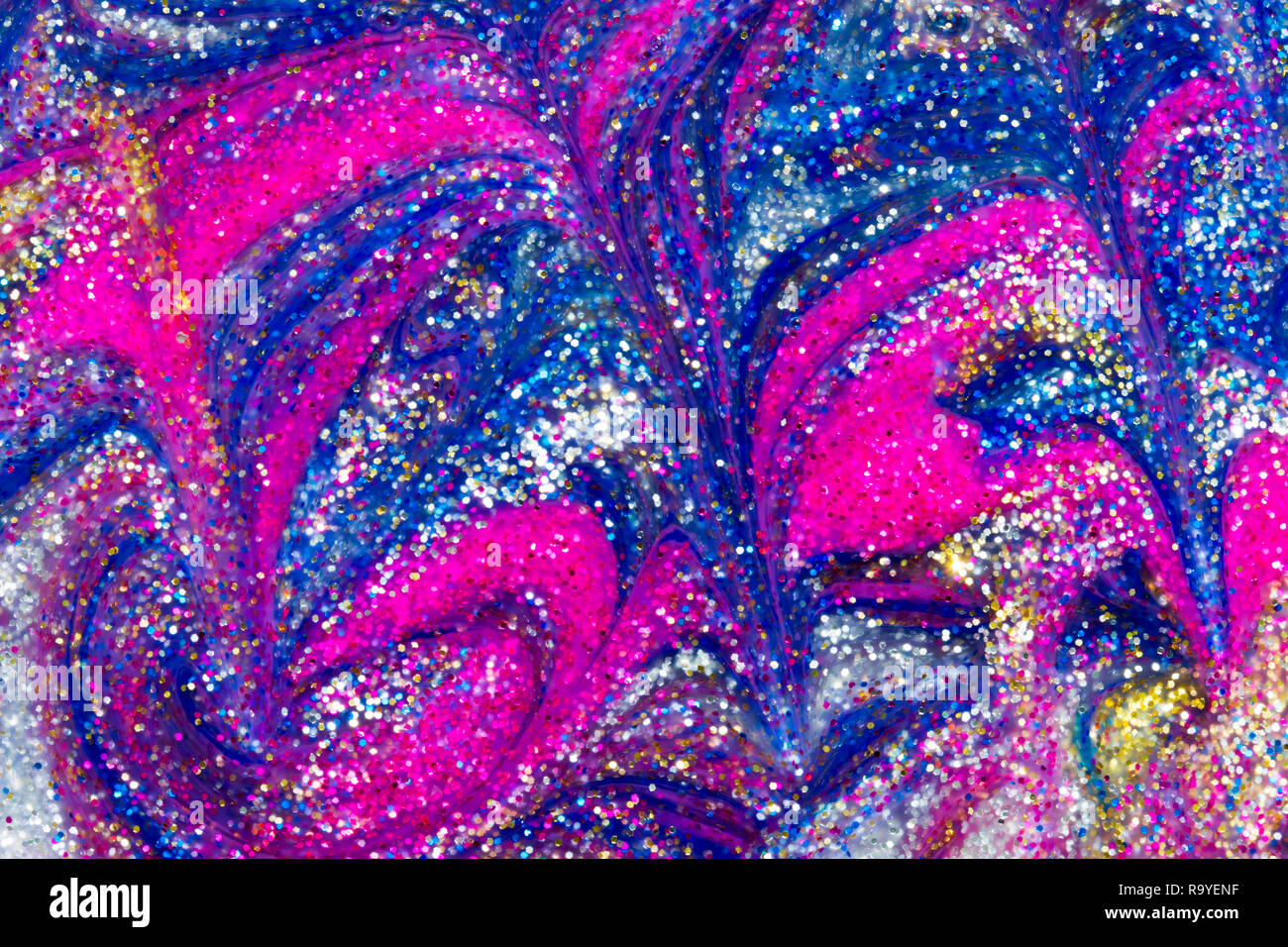 Abstract background of colorful metallic pink, blue, silver and gold ...