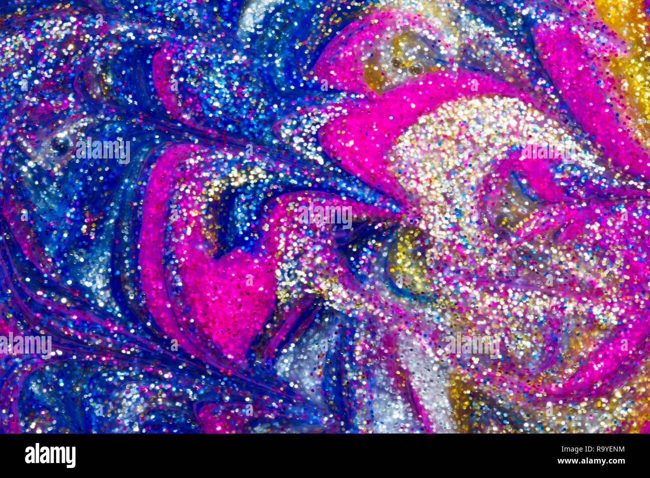 Abstract background of colorful metallic pink, blue, silver and gold ...