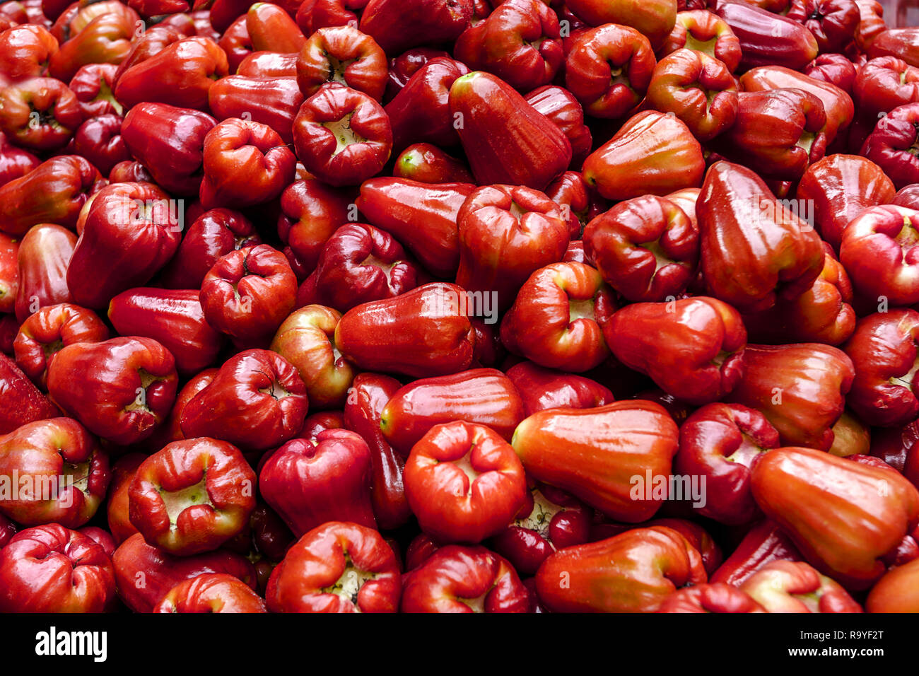 A large amount of red fruit at the market. Great for backgrounds Stock ...