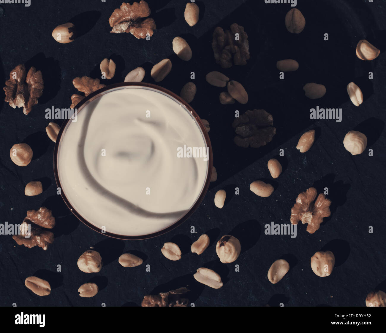 dairy and rustic farm food styled concept - fresh yogurt and nuts ...