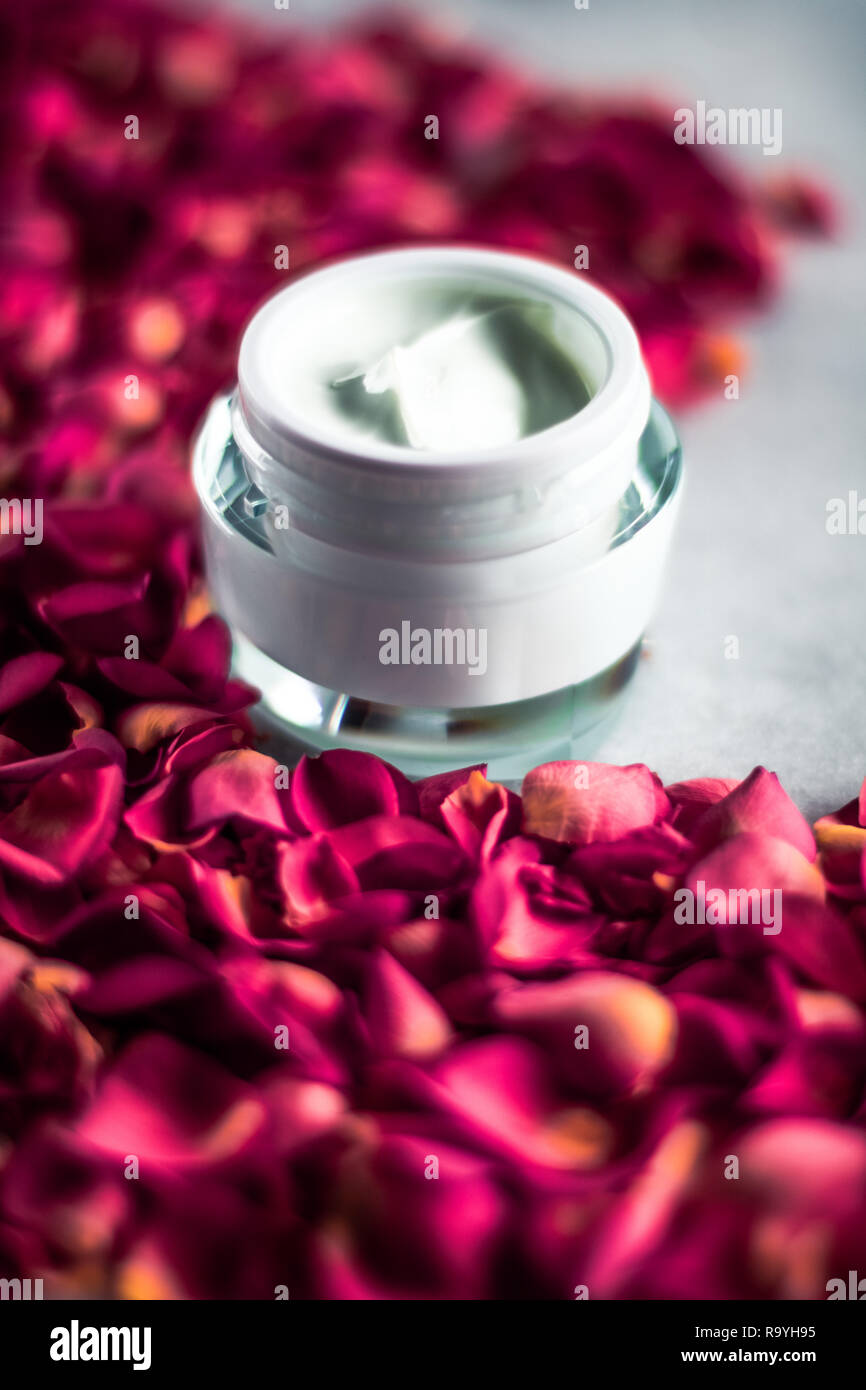 luxe face cream and rose petals - cosmetics with flowers styled beauty ...