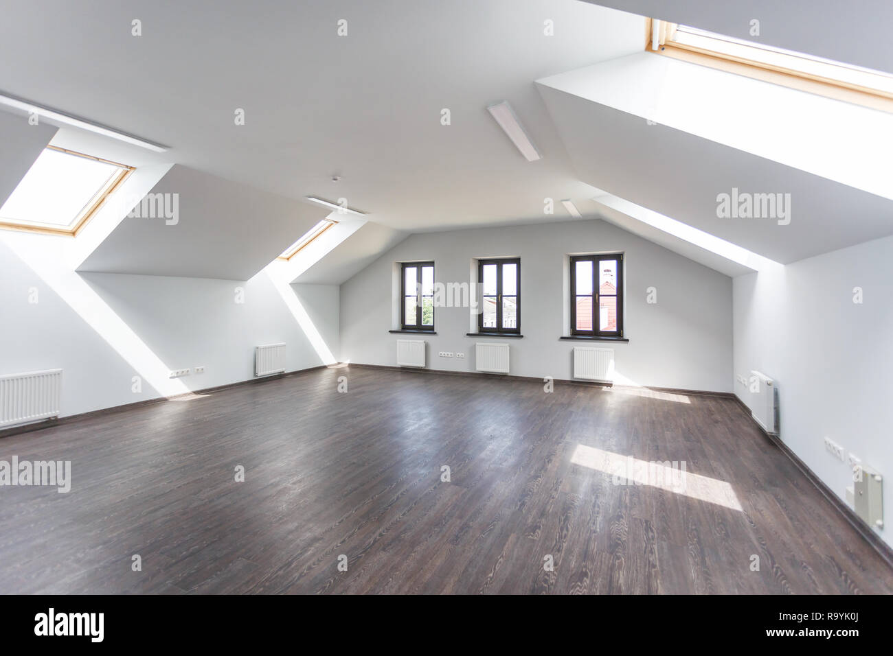Side view of unfurnished room interior with wooden floor on roof floor ...