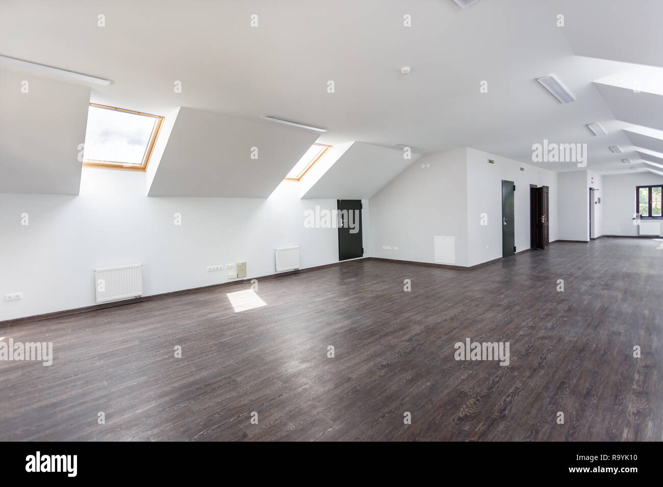 Side view of unfurnished room interior with wooden floor on roof floor ...