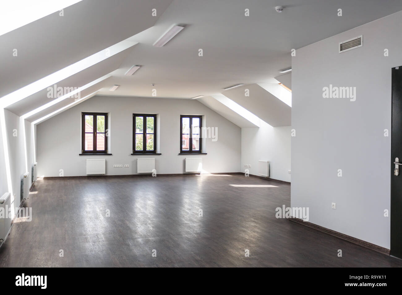Side view of unfurnished room interior with wooden floor on roof floor ...