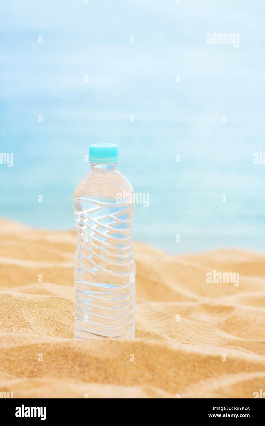 drinks, summertime and environment concept - bottle of water on the ...