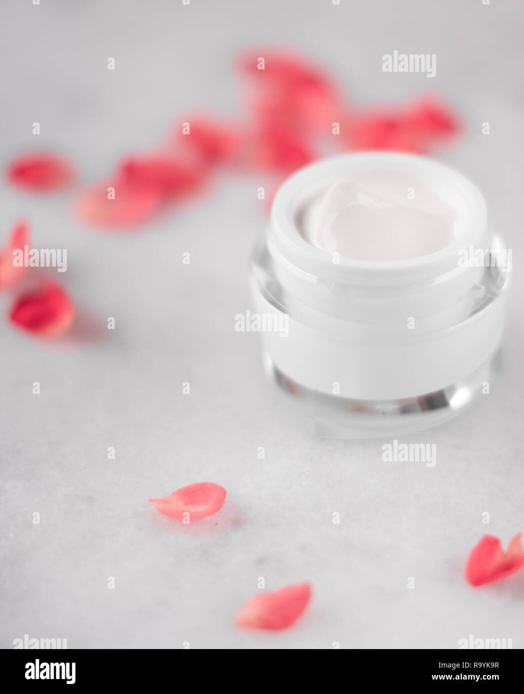 luxe face cream and rose petals - cosmetics with flowers styled beauty ...