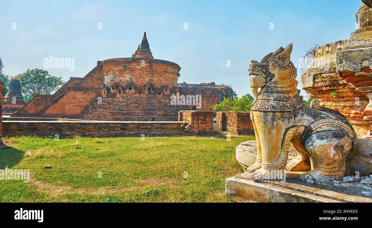 The carved chinthe (leogryph) at the foot of the ancient Lawka Dawtha ...