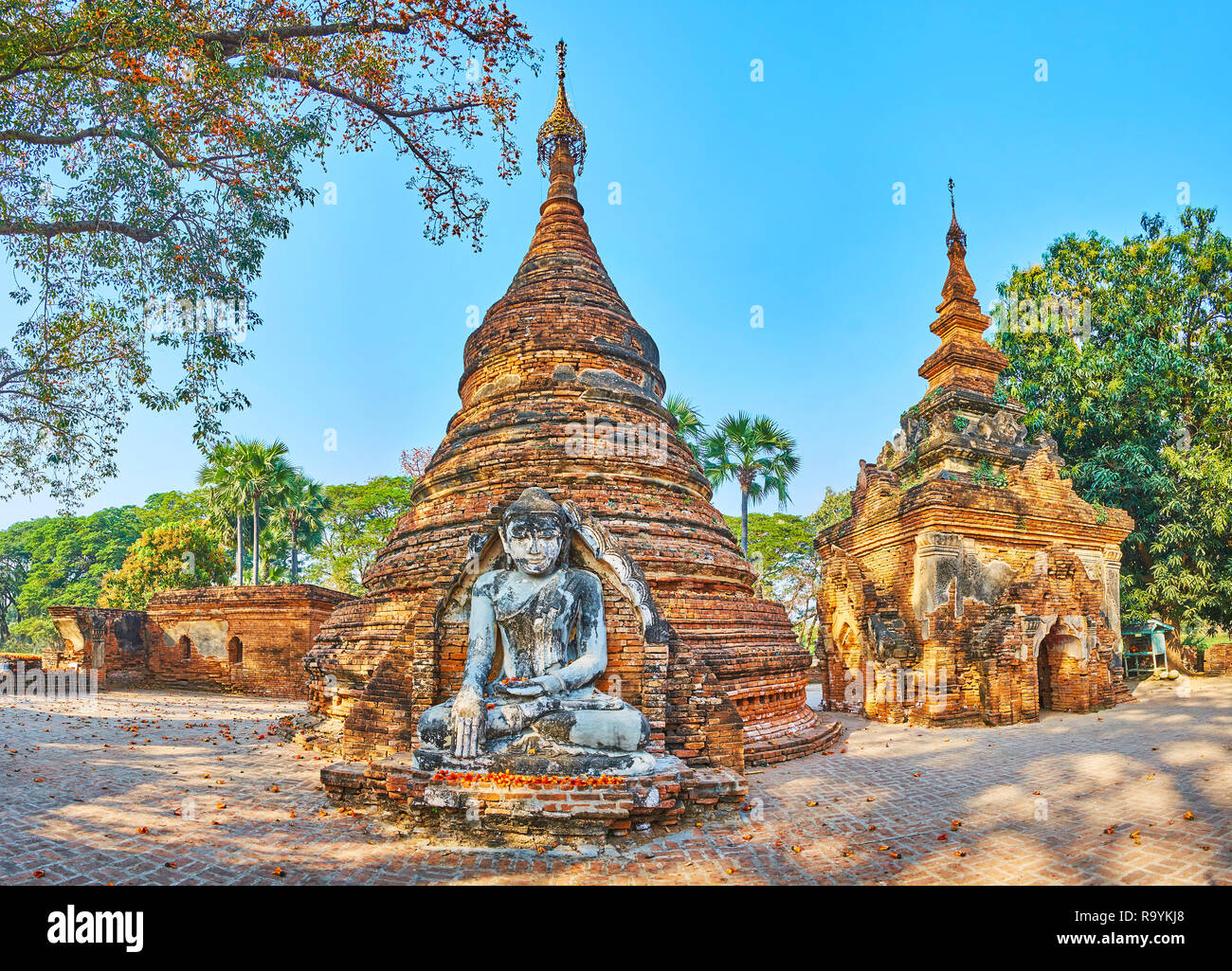 The altar of Lord Buddha in Yadana Hsemee Pagoda is decorated with ...