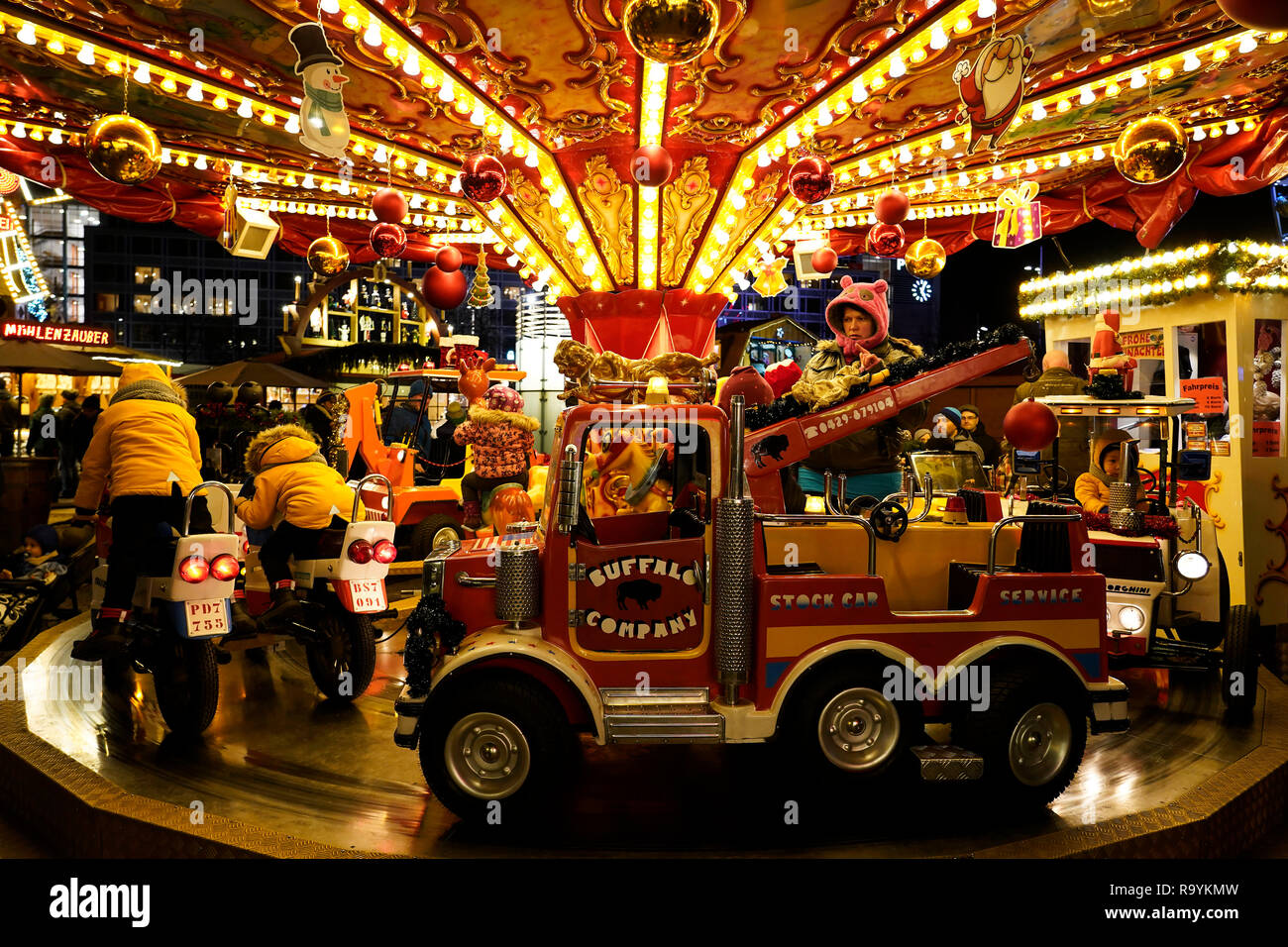 An illuminated carousel at the Christmas market in Leipzig, Saxony ...