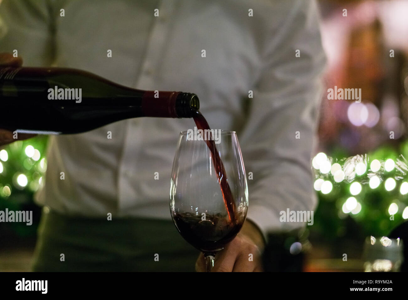 Wine waiter pouring wine hi-res stock photography and images - Alamy
