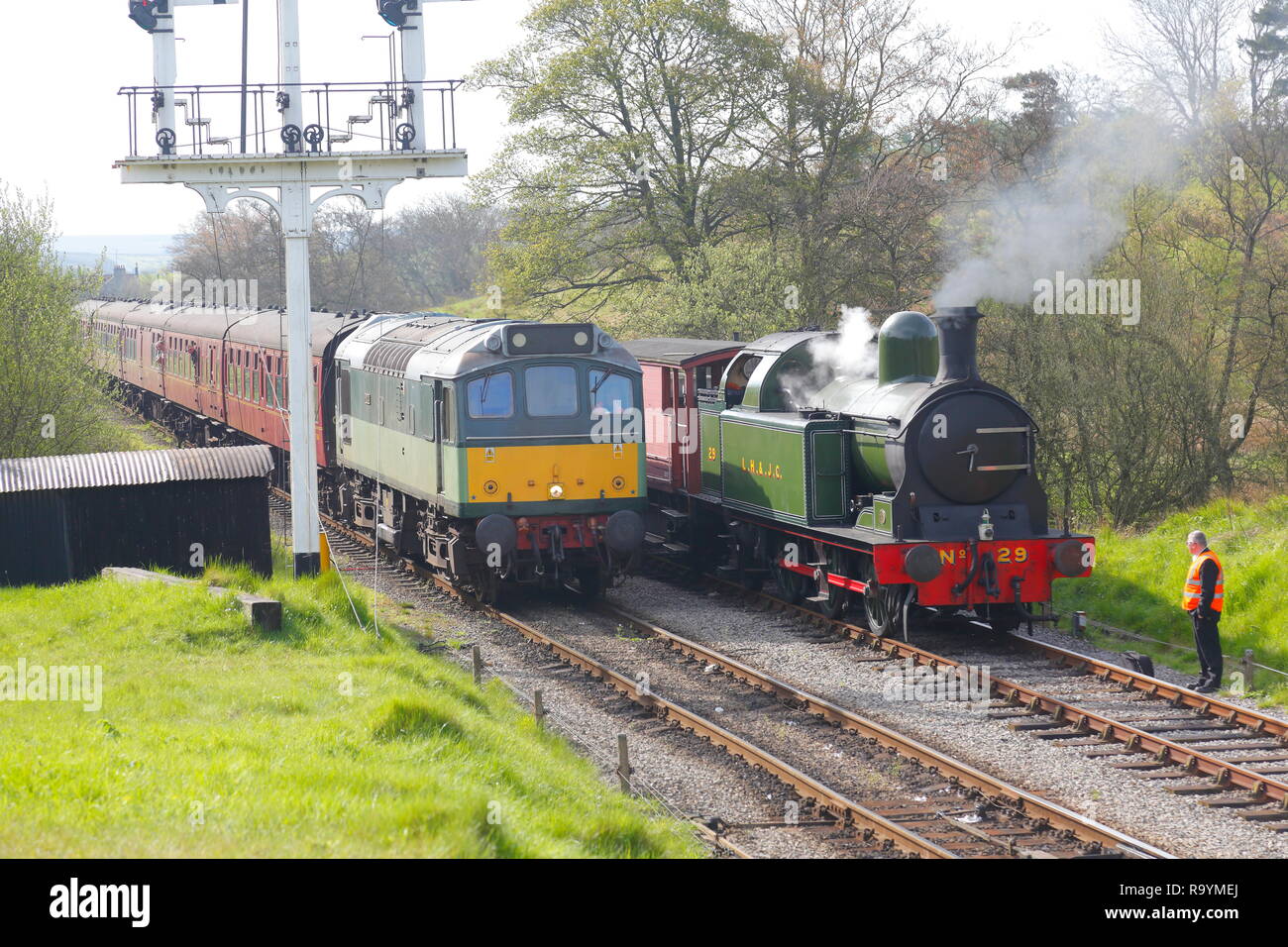 A Diesel & Lambtons Tank No29 Steam Locomotive stand side by side at ...