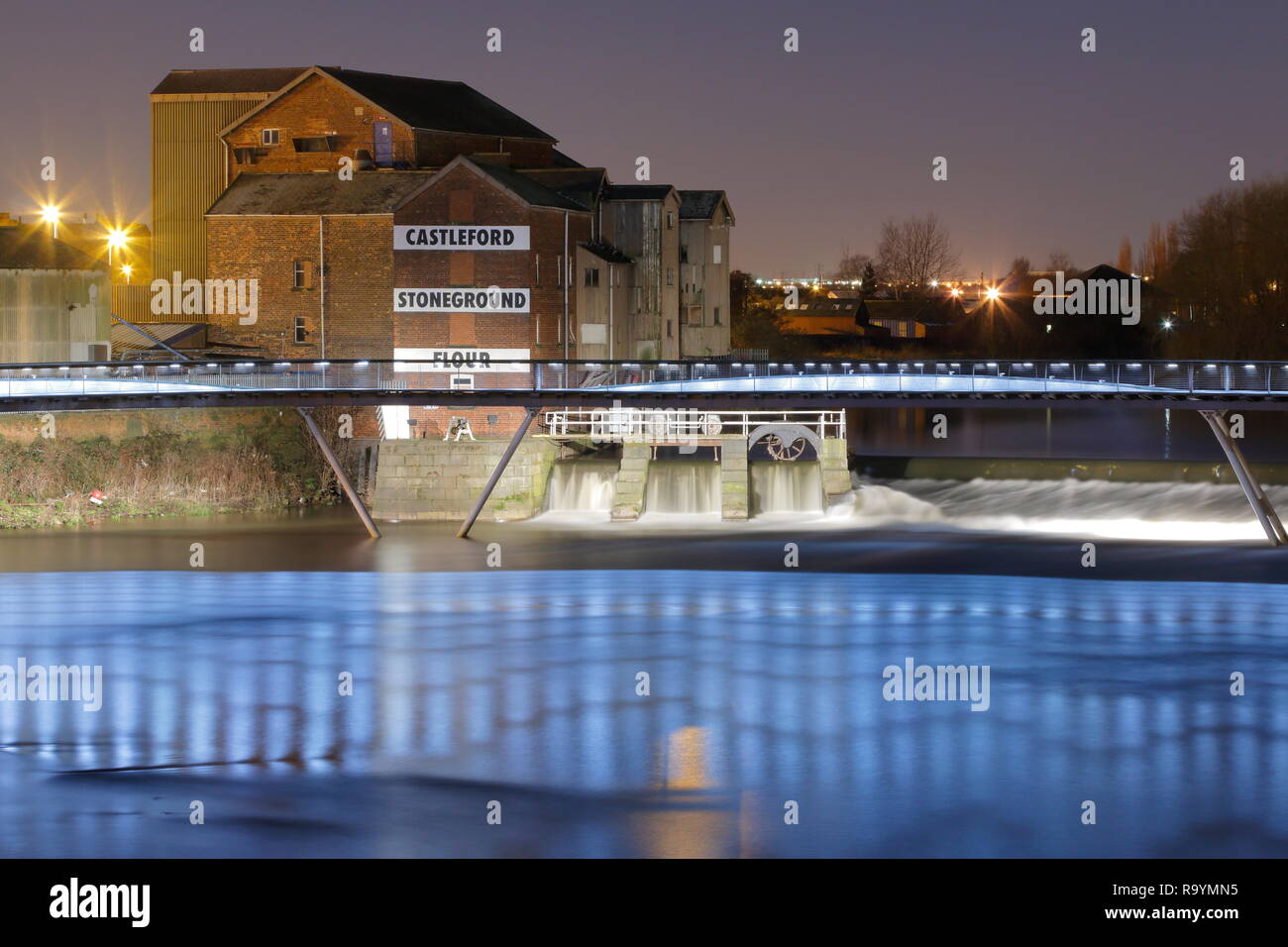 Queens Mill & Millennium Bridge on the River Aire in Castleford,West ...