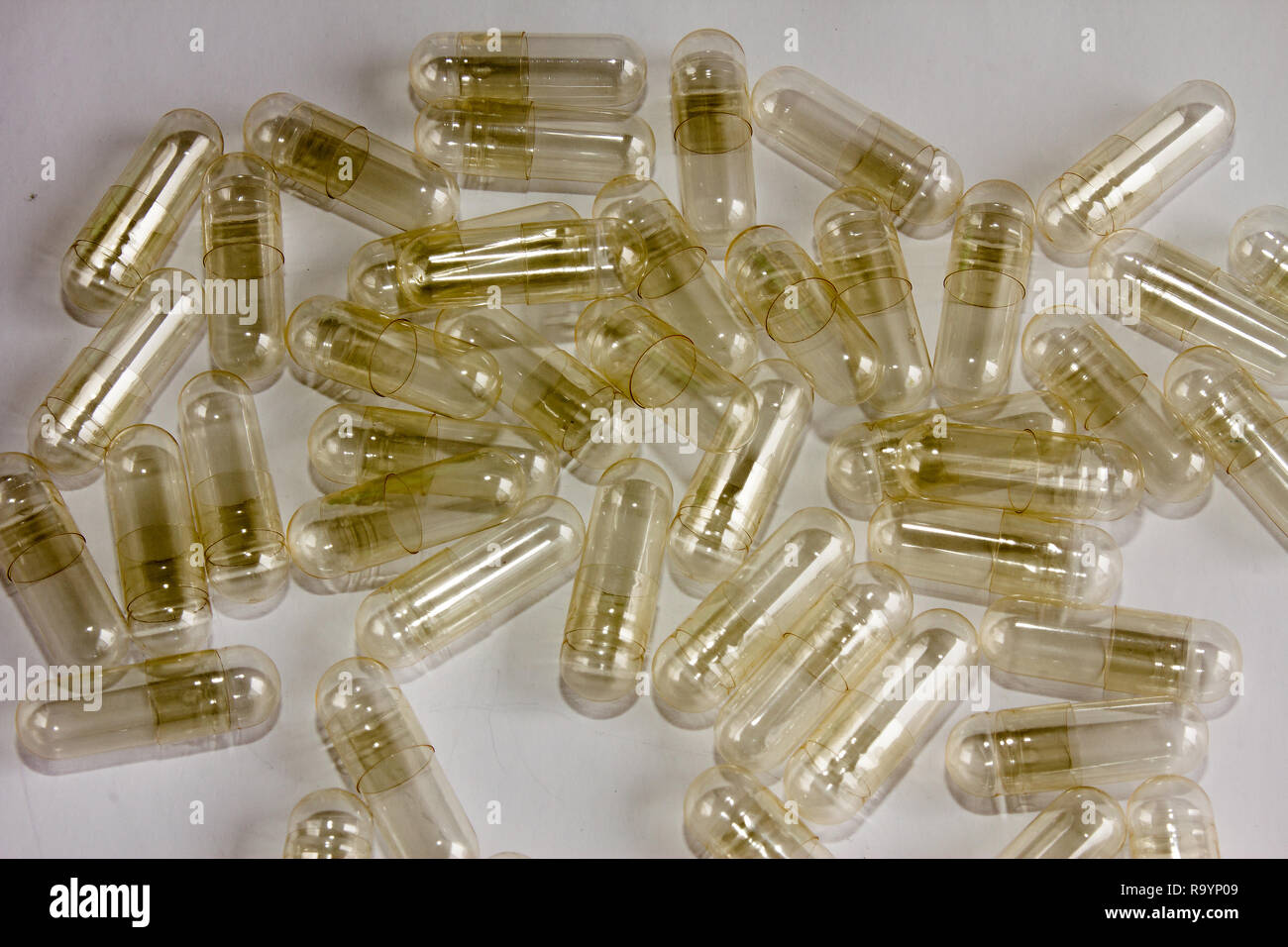 Transparant capsule drug isolated white background Stock Photo - Alamy