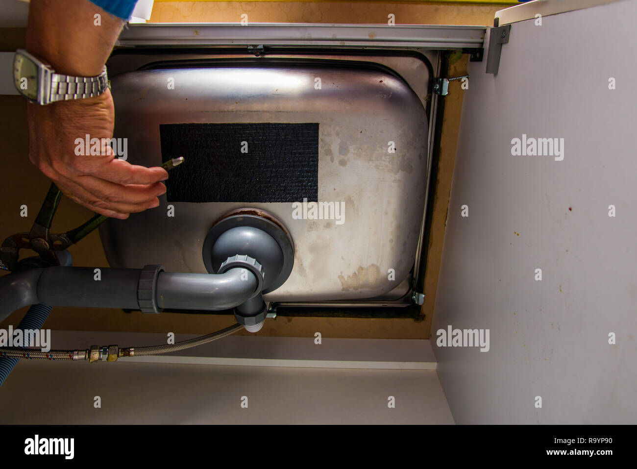 Senior man working pipes hi-res stock photography and images - Alamy