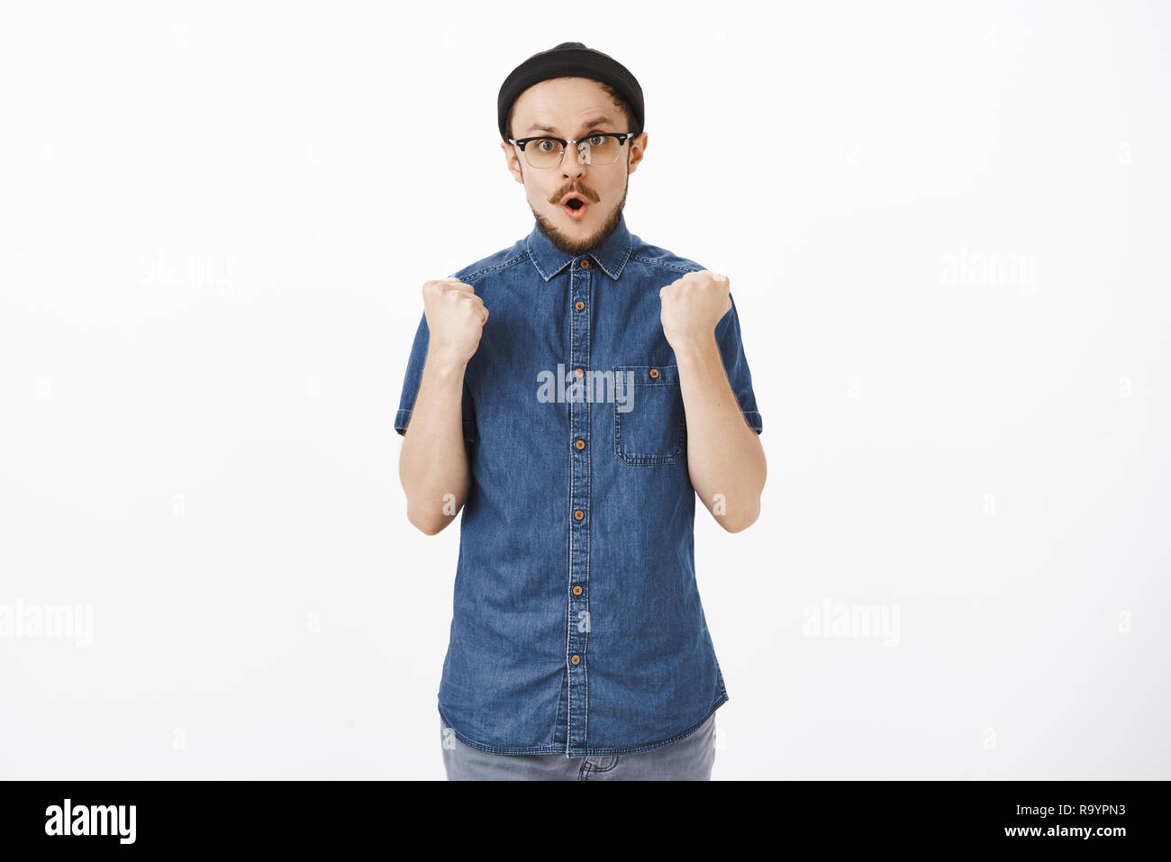 Man triumphing receiving awesome chance raising clenched fist in yes ...