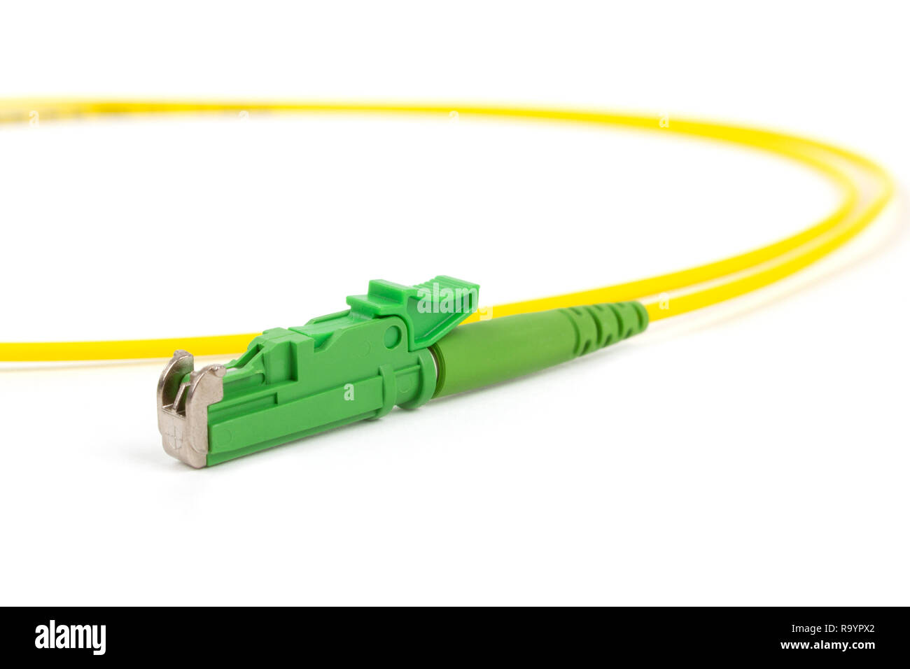 single mode patch cord jumper with green fiber optic connector isolated ...