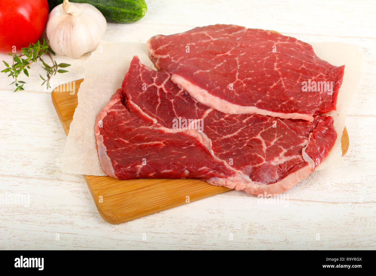 Raw beef steak ready for cooking Stock Photo - Alamy