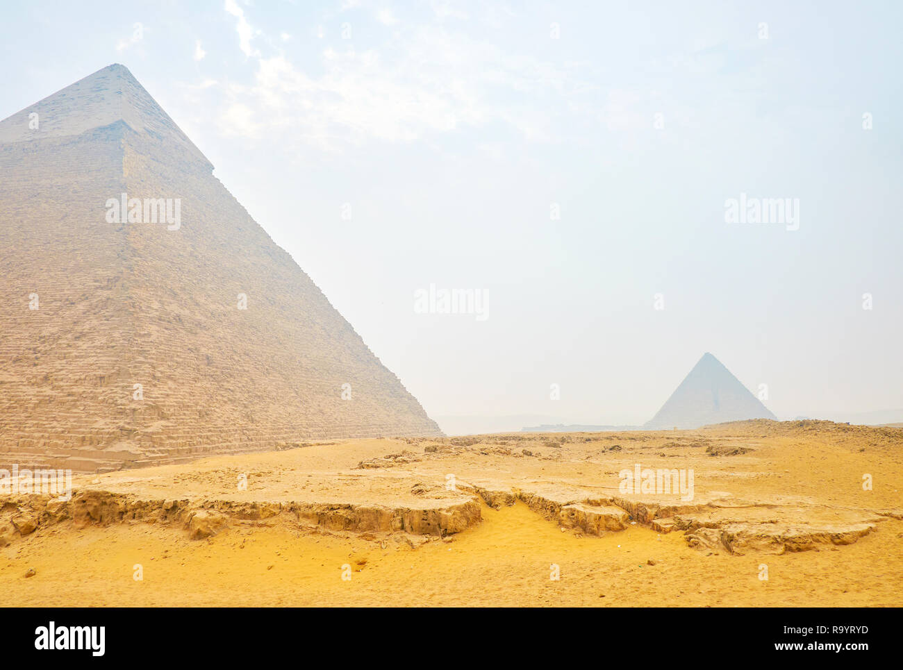 The Giza pyramid complex located in the midst of the sand dunes and ...