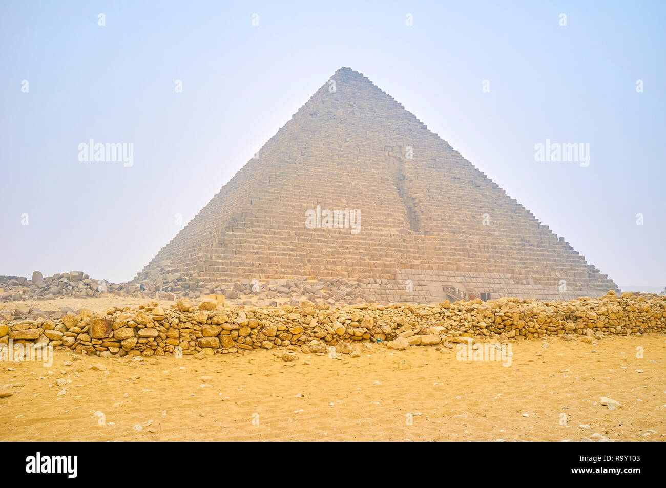 The small and beautiful Pyramid of Menkaure with ruined side wall and ...
