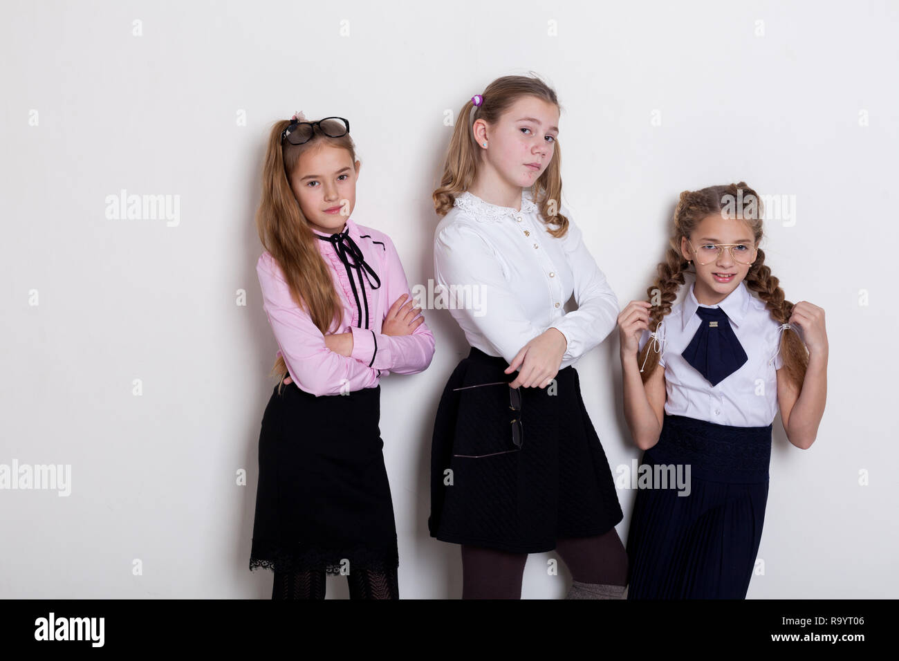 three girls at school boards in the classroom lesson Stock Photo - Alamy