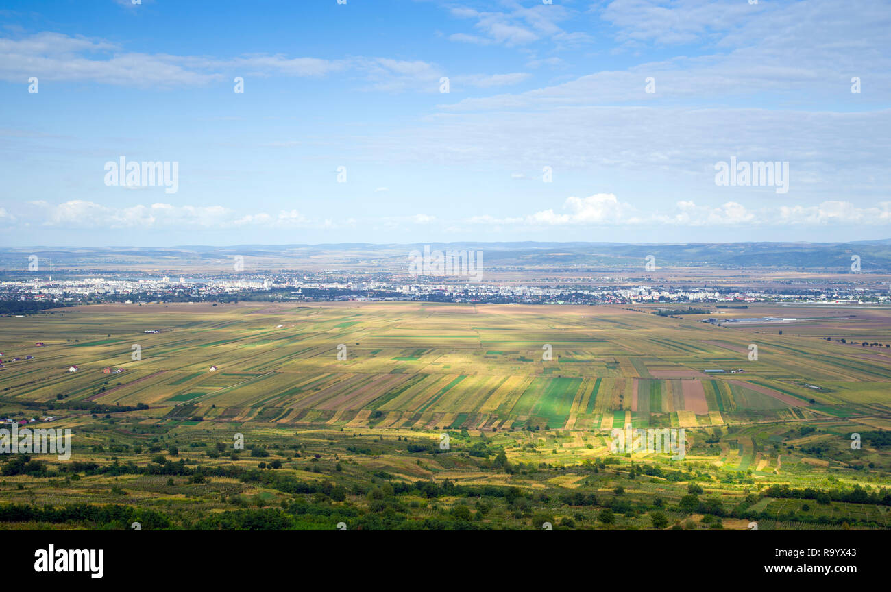 Summer landscape: cultivated fields and aerial view of Bacau, Romania ...