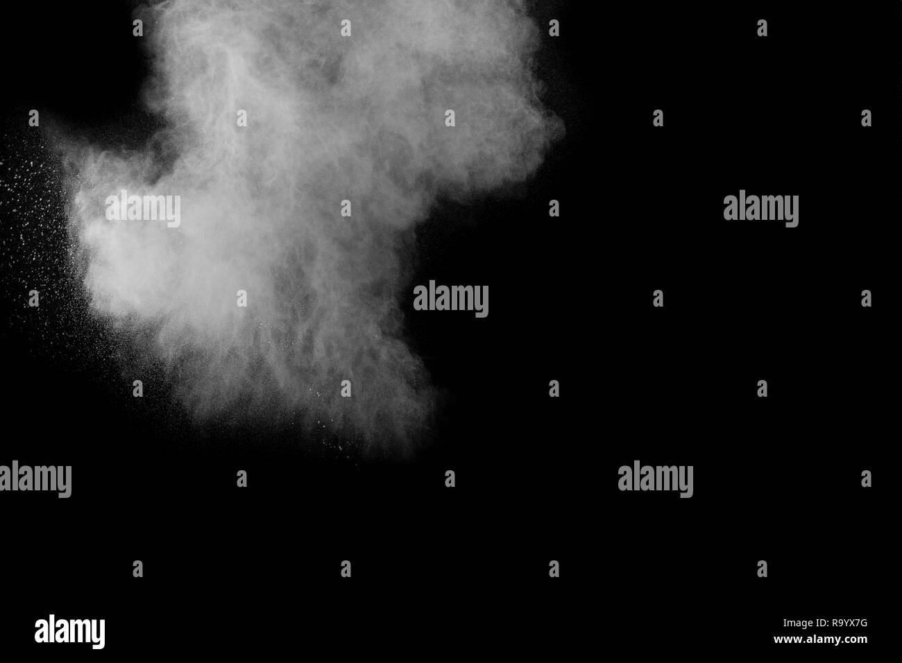 Bizarre forms of white powder explosion on white background.Launched ...