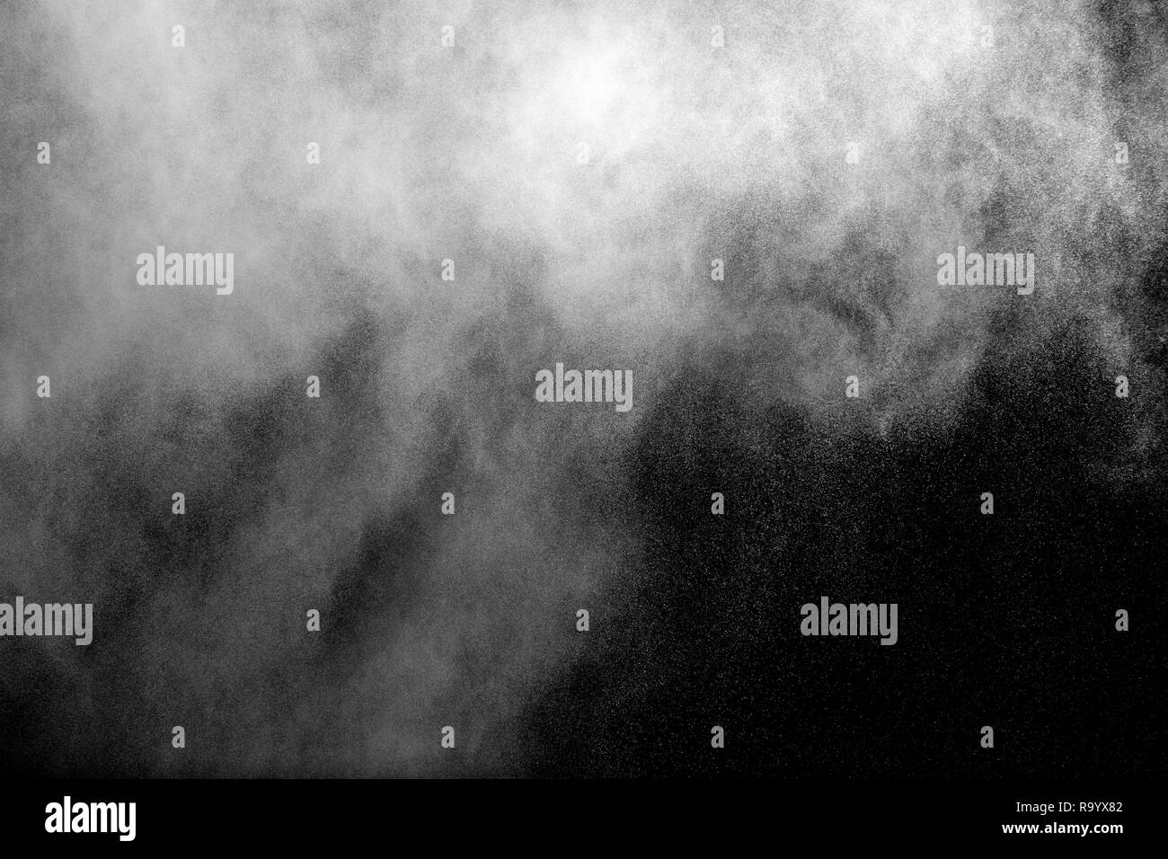 Bizarre forms of white powder explosion on white background.Launched ...