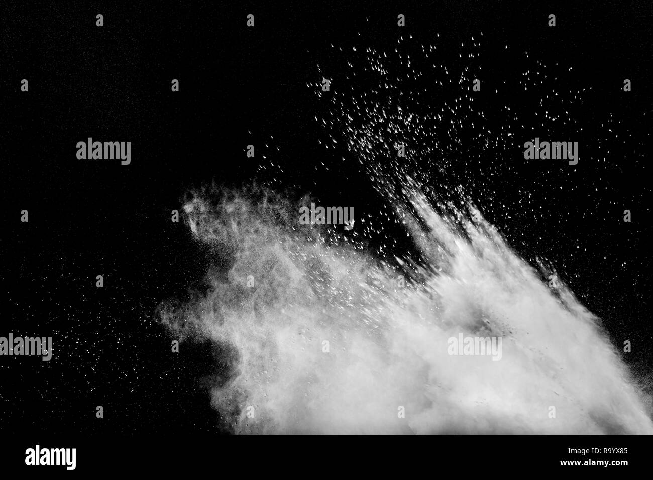 Bizarre forms of white powder explosion on white background.Launched ...