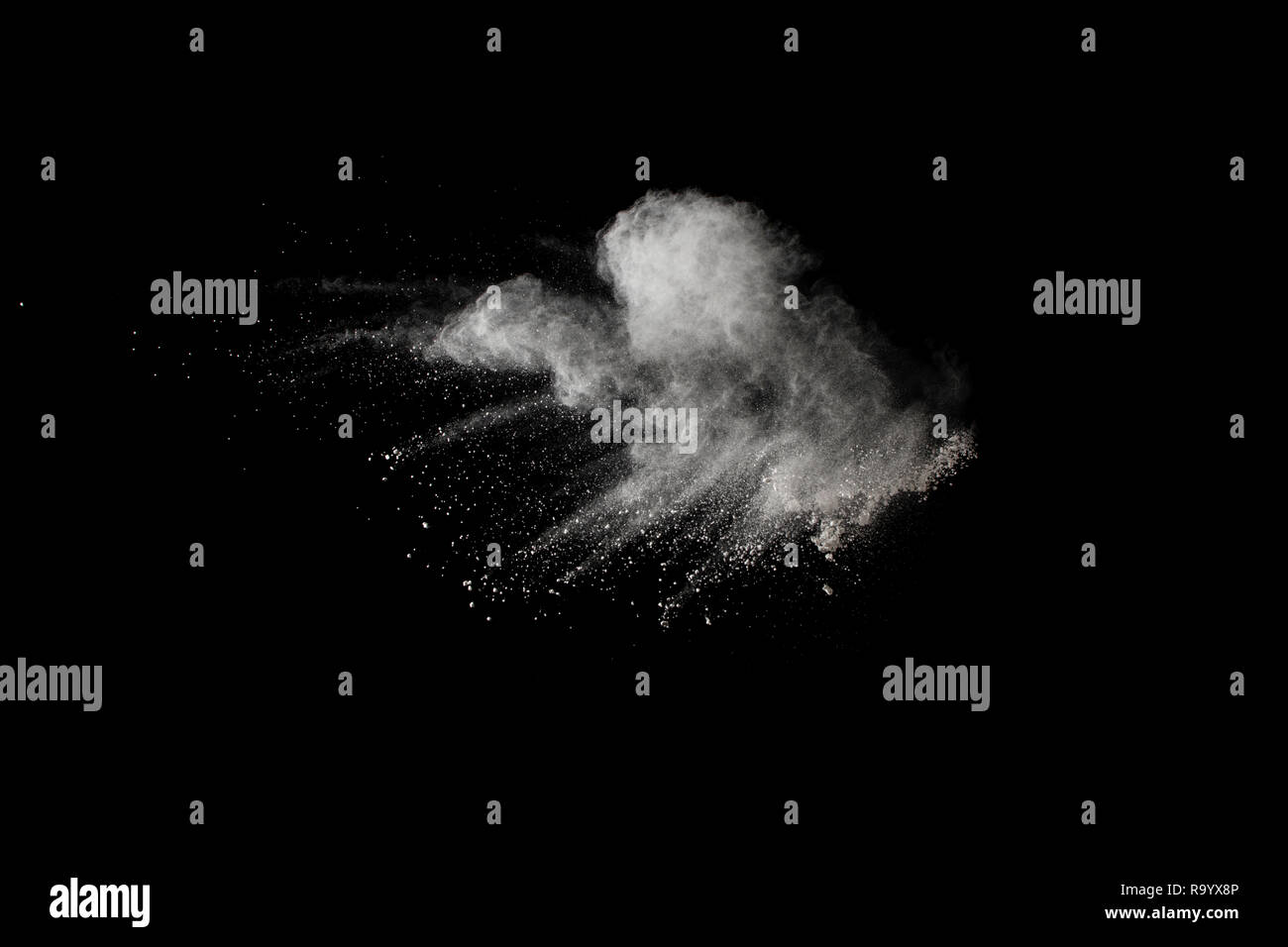 Bizarre forms of white powder explosion on white background.Launched ...