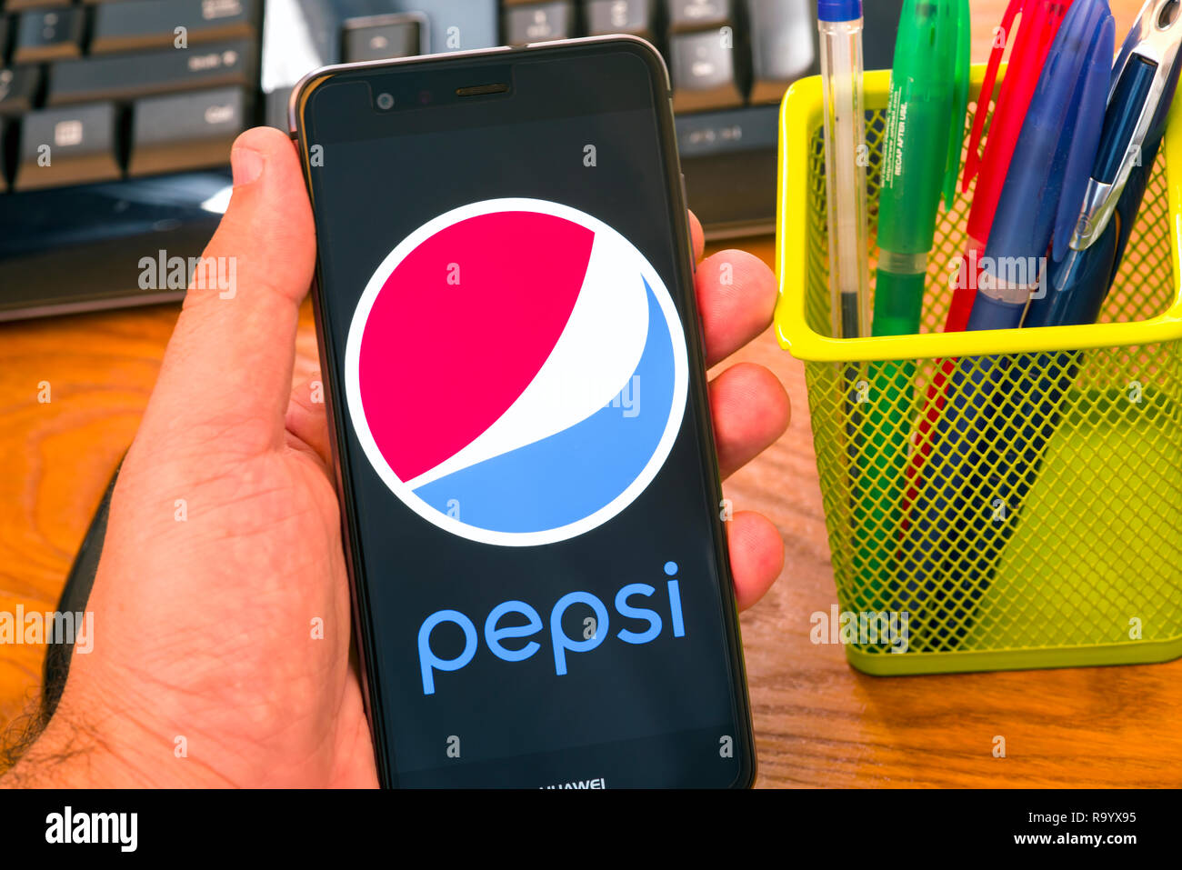 PIATRA NEAMT, ROMANIA - JULY 30, 2018: Hand holds a mobile phone with ...