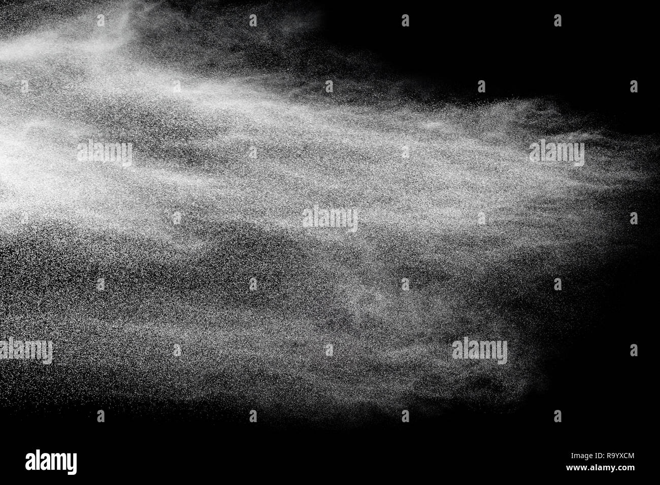 Bizarre forms of white powder explosion on white background.Launched ...