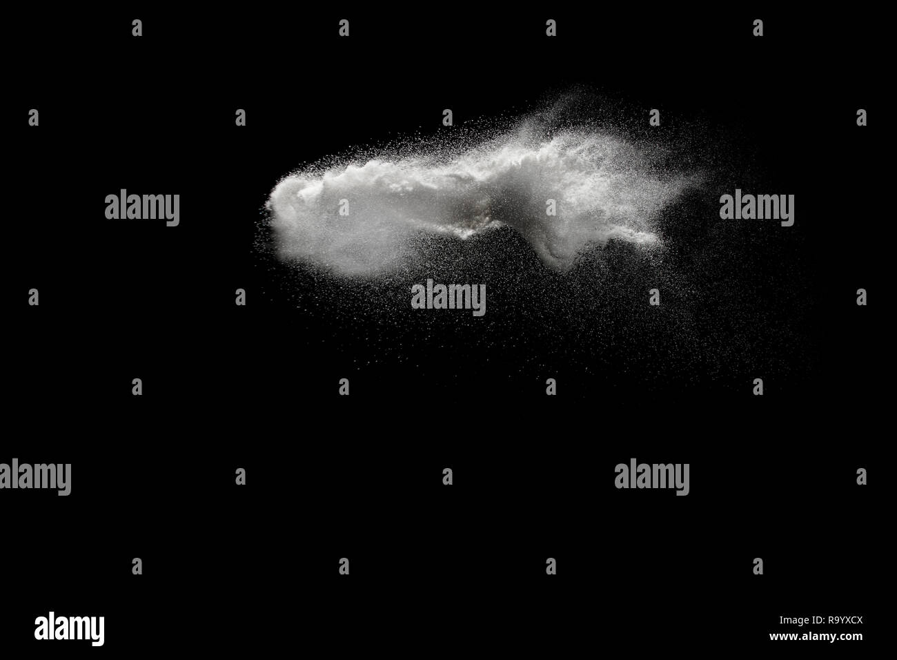 Bizarre forms of white powder explosion on white background.Launched ...