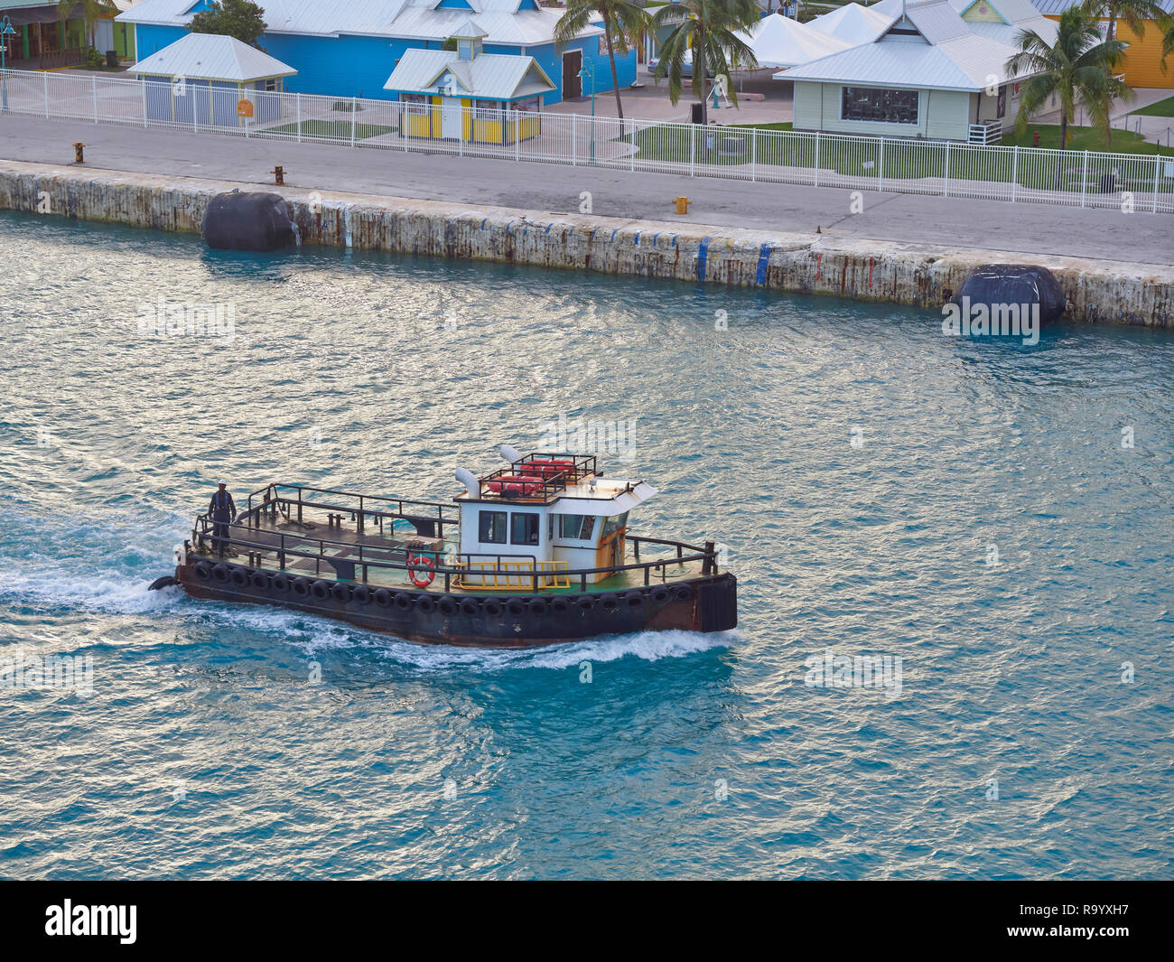 One of the small Line handling Boats coming to a Vessel to help tie the ...