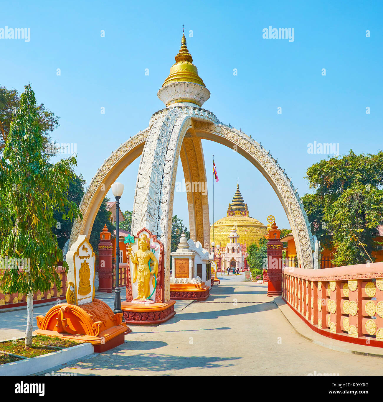 SAGAING, MYANMAR - FEBRUARY 21, 2018: The scenic stupa-shaped gate of ...