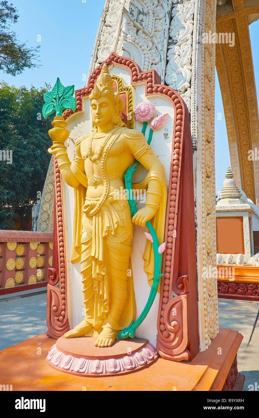 The statue of Nat (Spirit deity) in front of the entrance gate to the ...