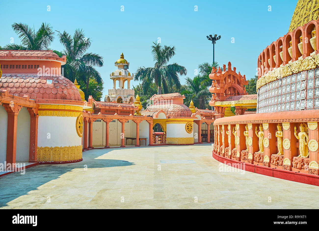 Walk the circle alley around the ornate stupa of temple of Sitagu ...