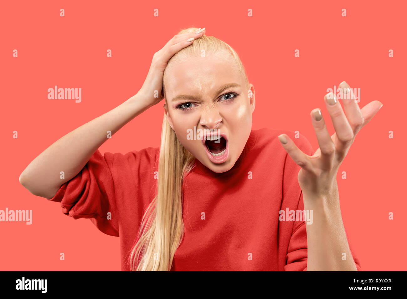 Angry woman looking at camera. Aggressive business woman standing ...