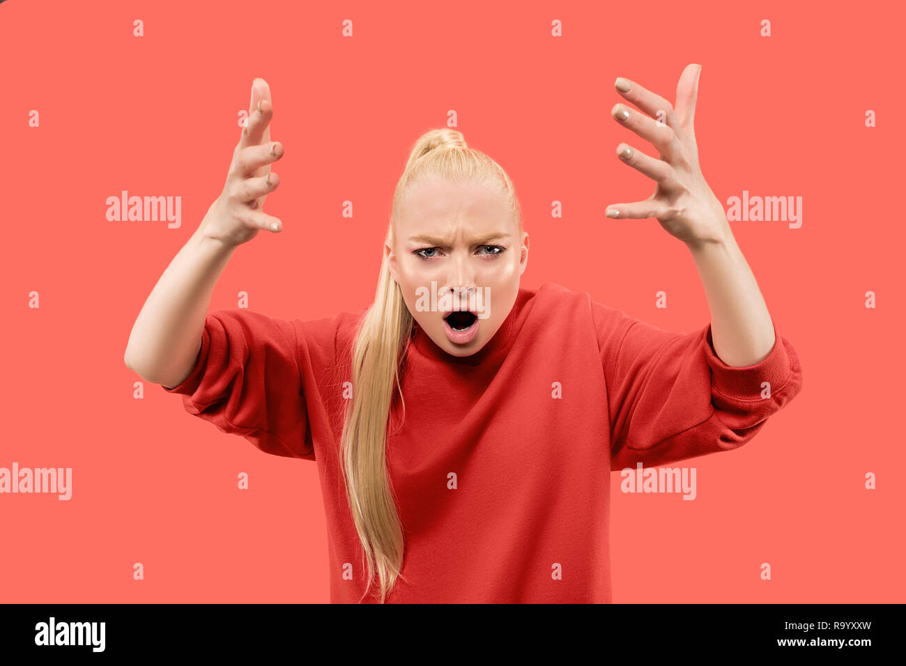 Angry woman looking at camera. Aggressive business woman standing ...