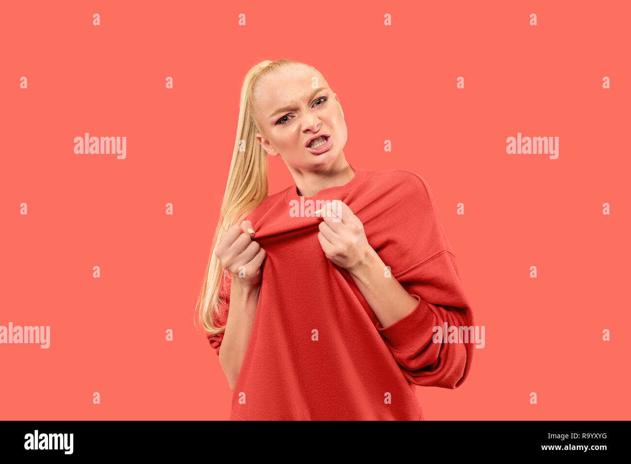 Angry woman looking at camera. Aggressive business woman standing ...