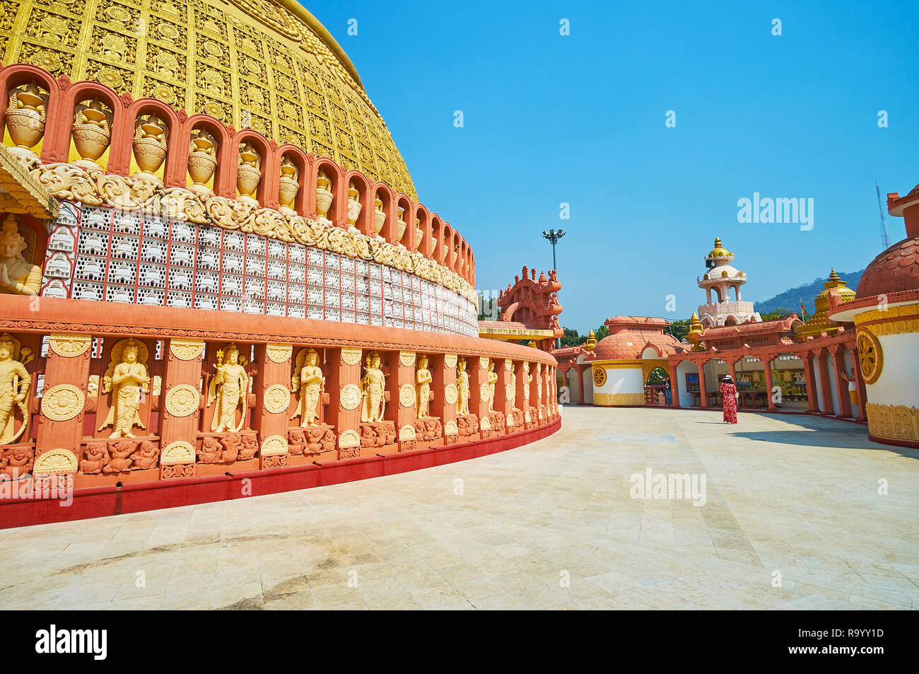 SAGAING, MYANMAR - FEBRUARY 21, 2018: The sunny alley around the pagoda ...