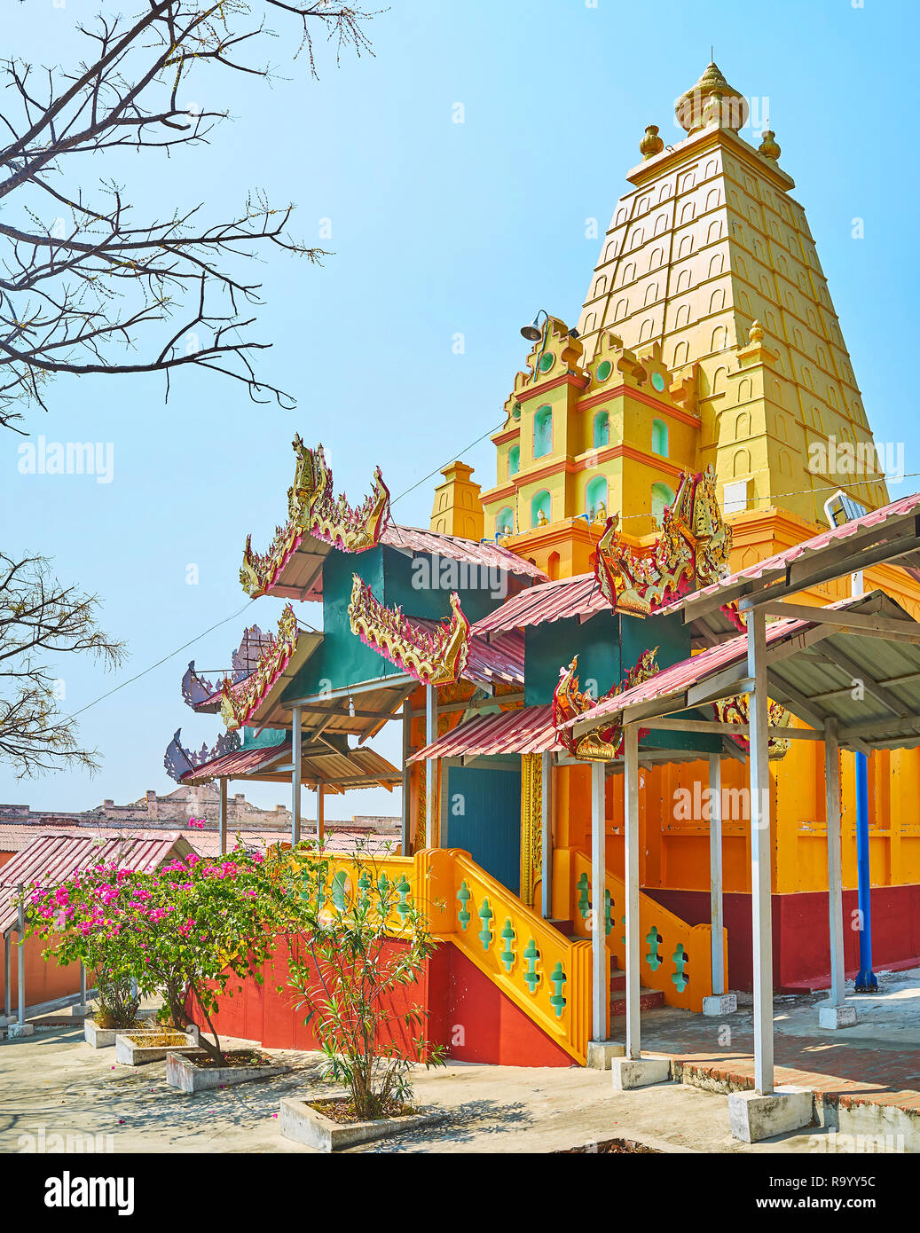 The ornate pagoda of U Min Thonze Caves with beautiful colored porch, decorated with pyatthat ...