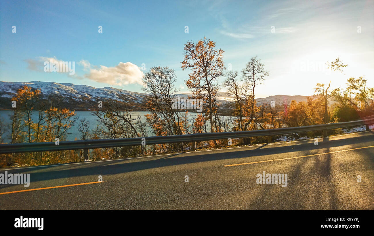 Beautiful September landscape on the snowy shores of a calm northern ...